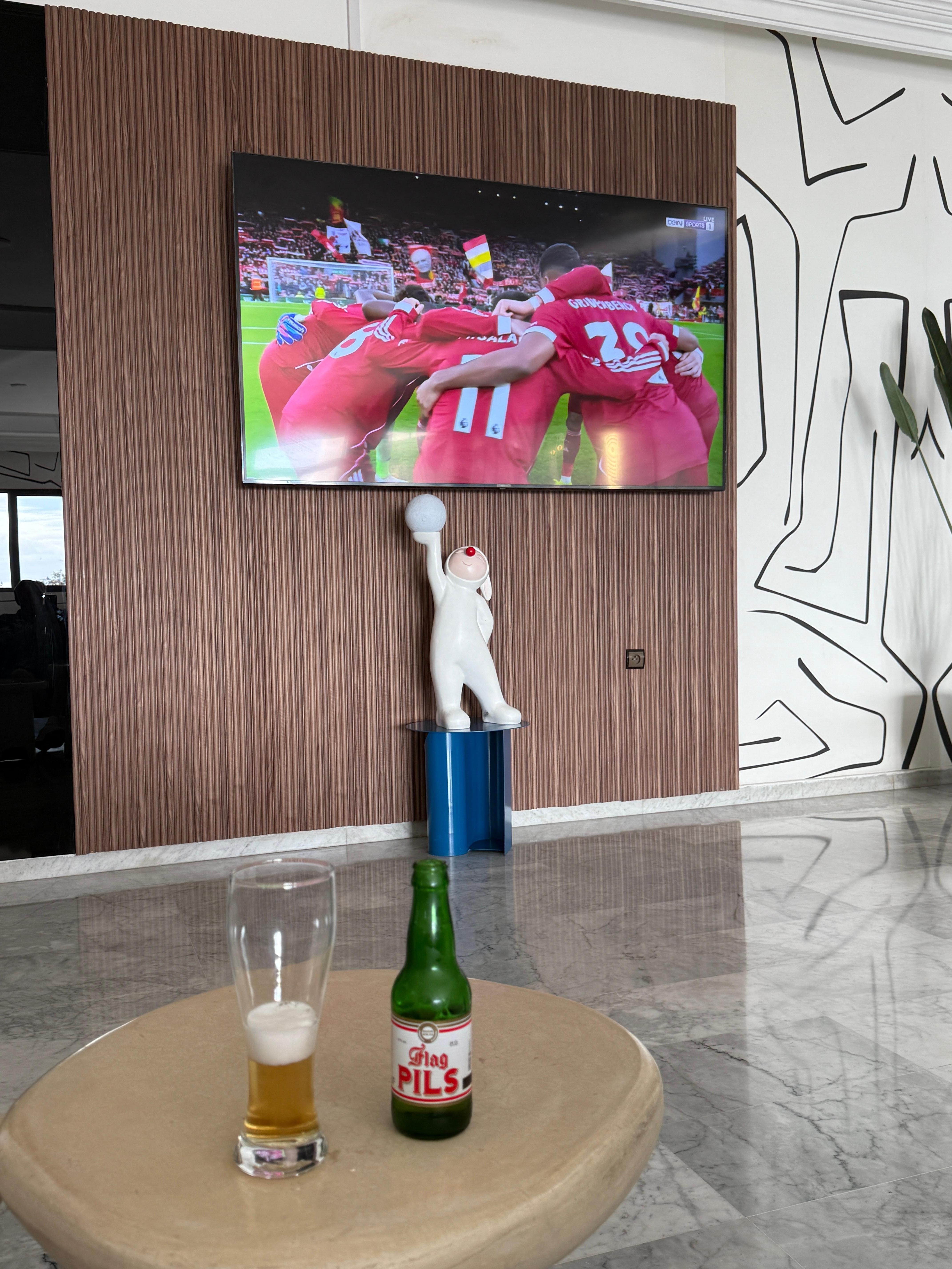 big screen tv in lounge with Liverpool fc live