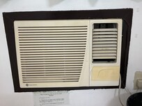 Old air conditioner noisy and not working properly as the room was still hot