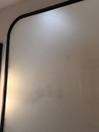 Curse word upper left of mirror