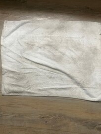 Floor after wiping it with a damp towel.