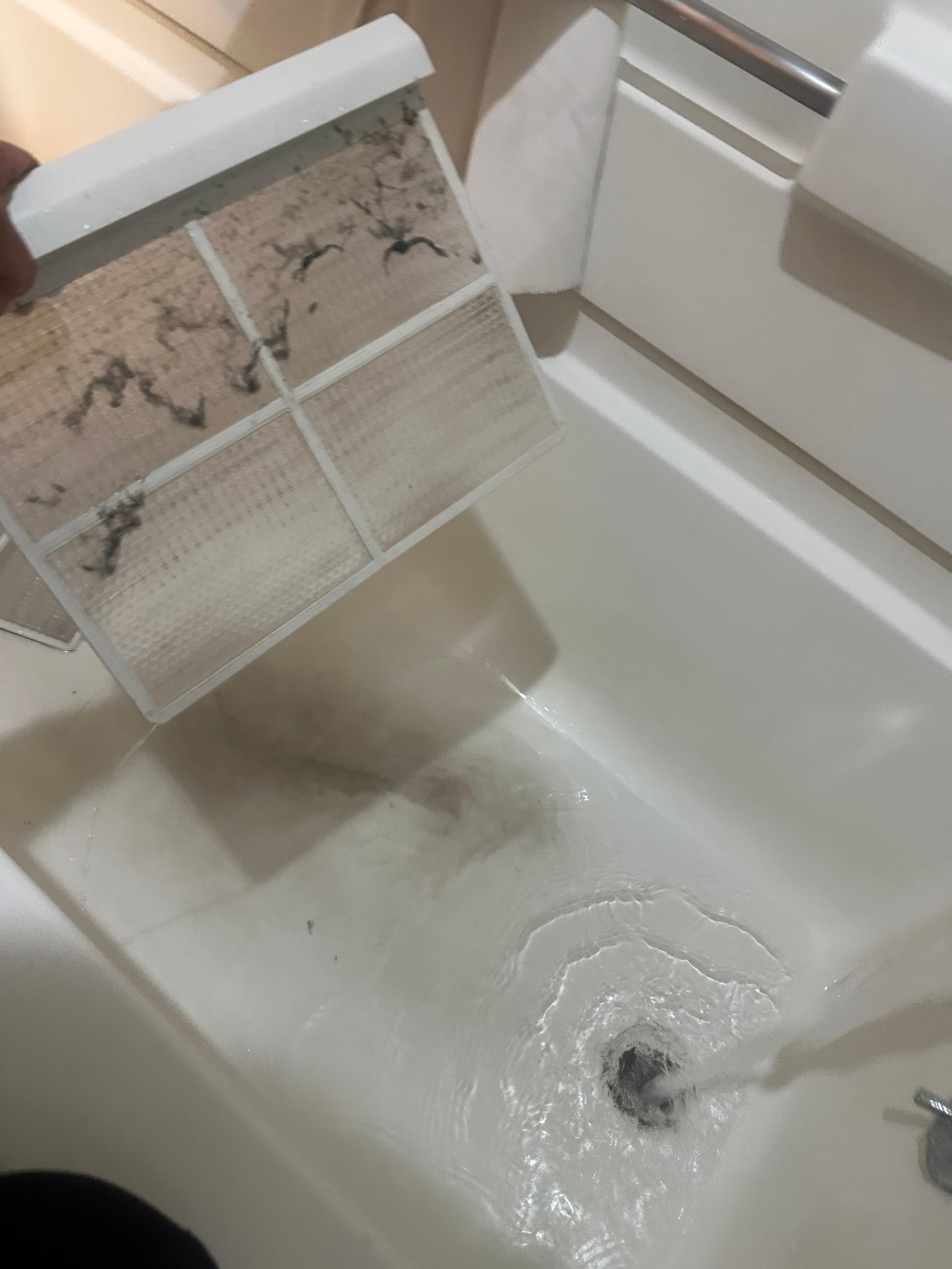 rinsing the dirty air filter