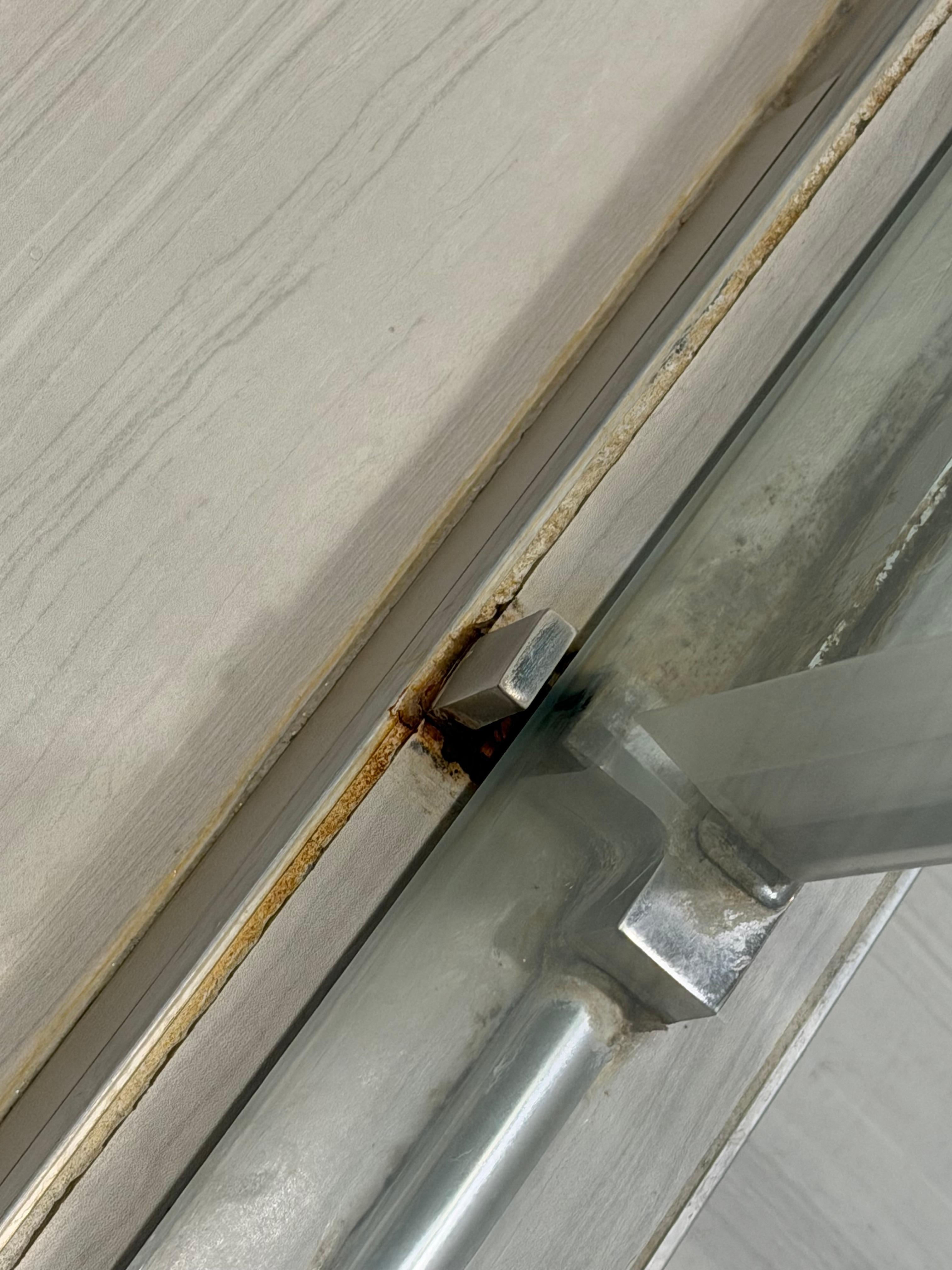 Close up of condition of shower upon arrival.