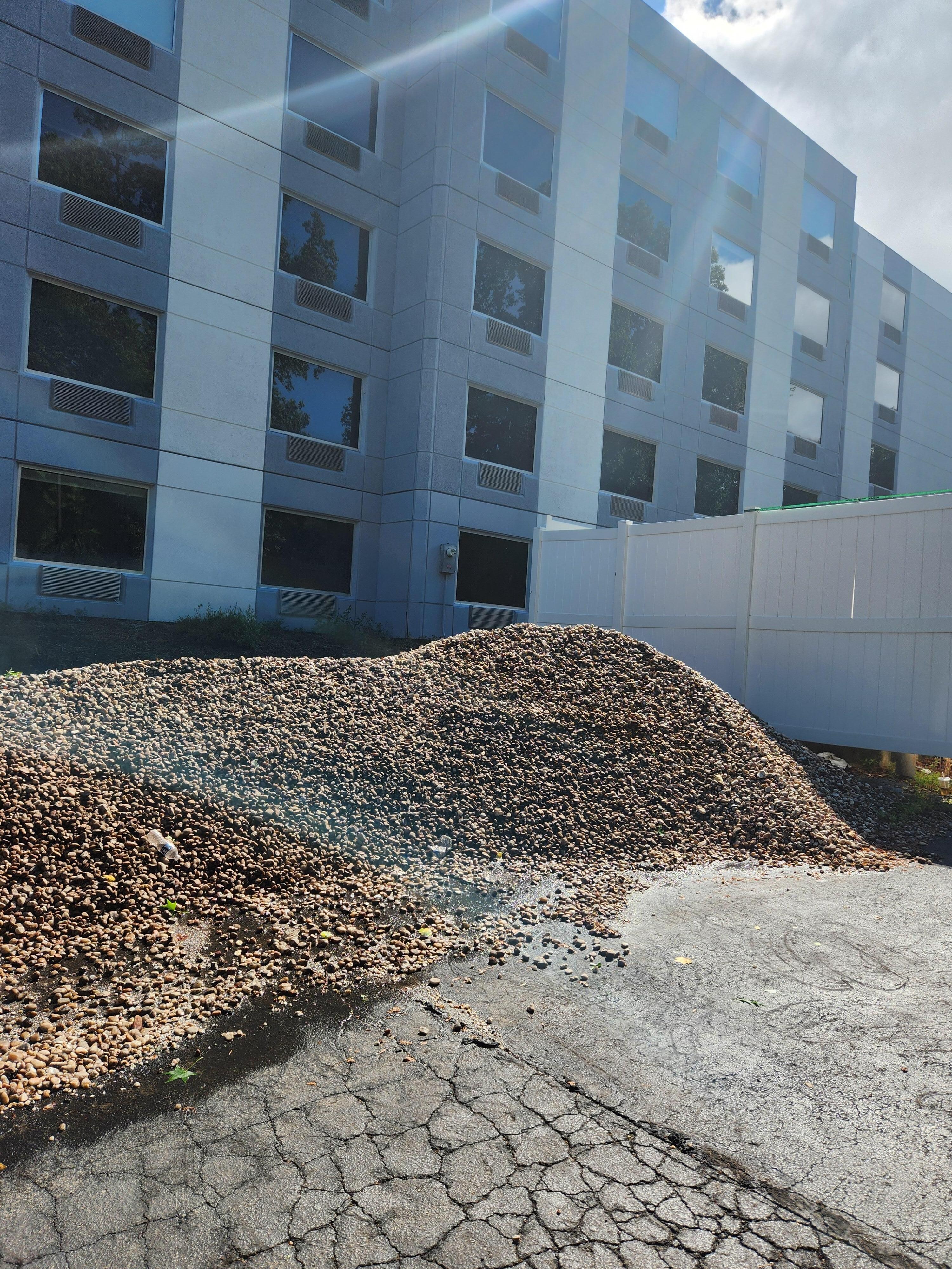 Parking area with pile of rocks