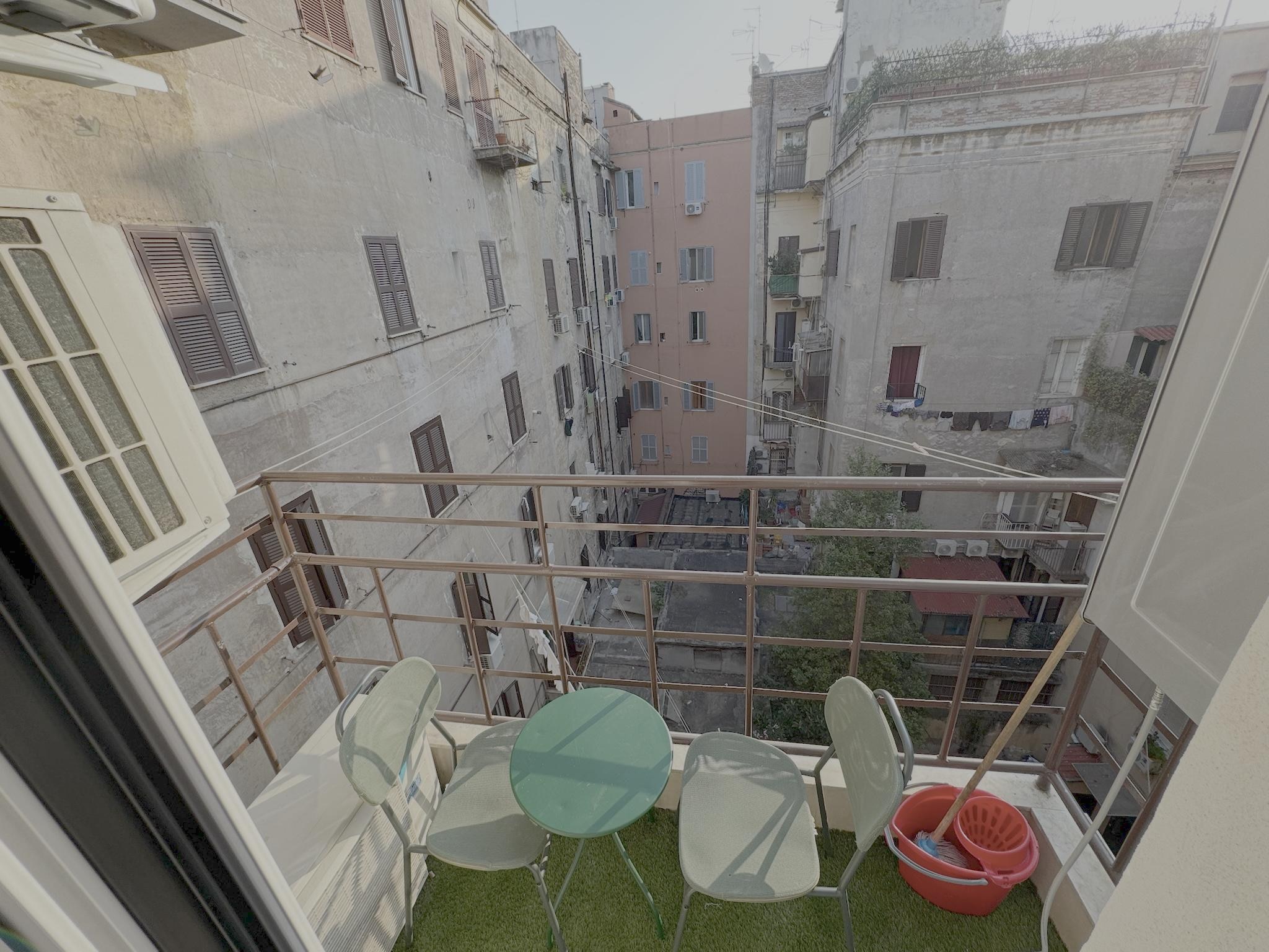 Actual balcony and view - multiple A/C units and water unit, mops and mess - how is this LUXURY???