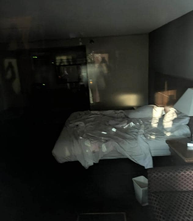 photo through the window with blinds open of the room I was assigned, clearly room has been used prior to my arrival