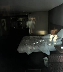 photo through the window with blinds open of the room I was assigned, clearly room has been used prior to my arrival