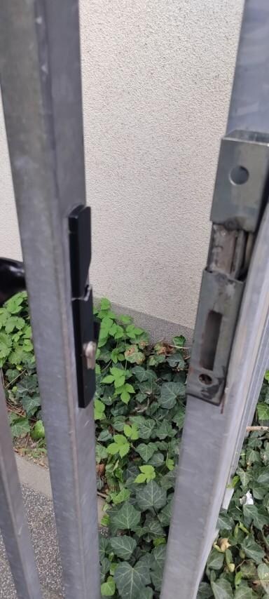 Close-up images of broken gate lock: Clearly visible damage showing major security risk