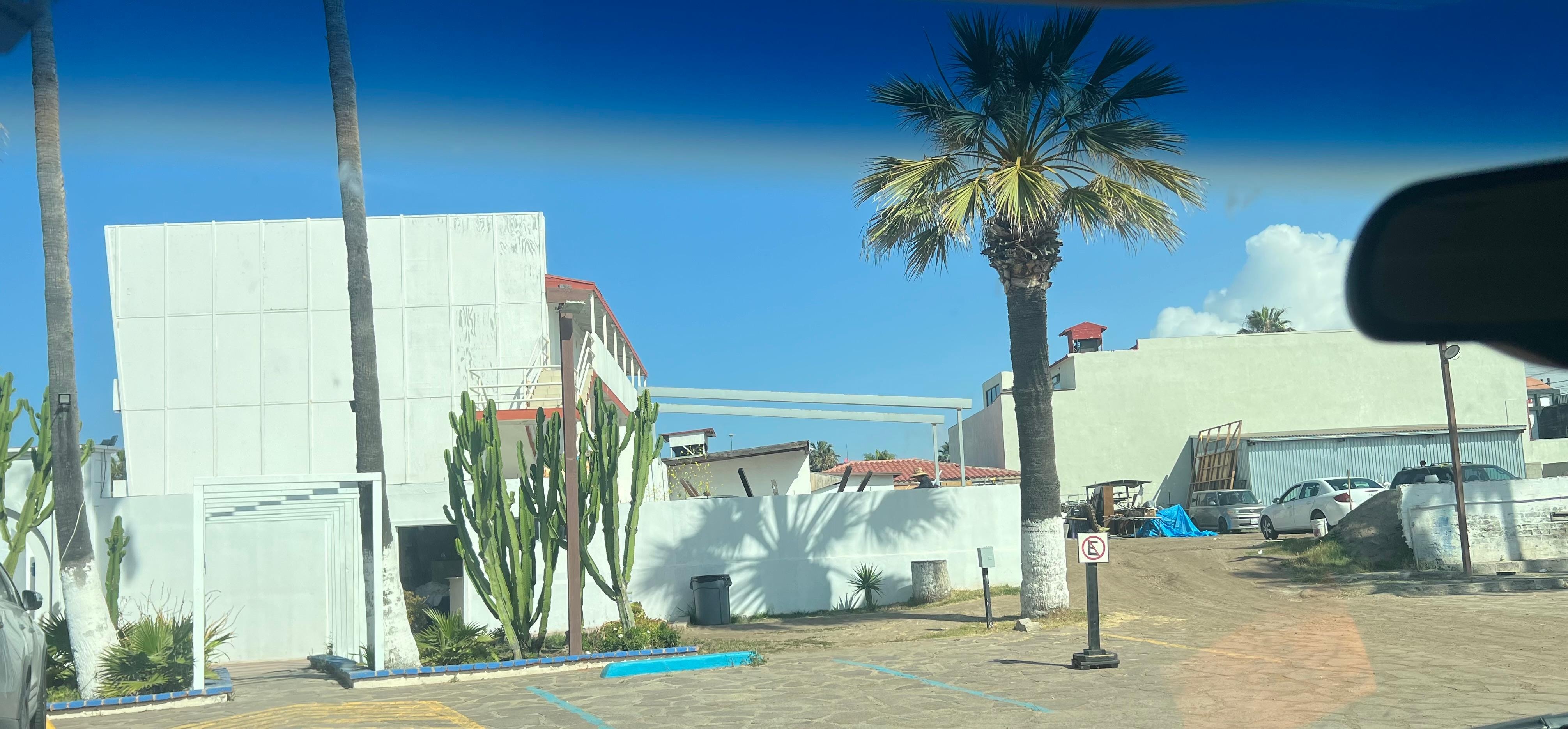 3 story hotel rooms on the left , you will need to walk up very steep stairs.