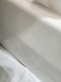Hair on the side of the bathtub