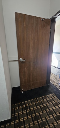 Fire door blocked, these are Fire rated doors and are useless when blocked open.