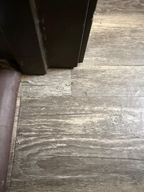 Debris in the entry going into the bathroom