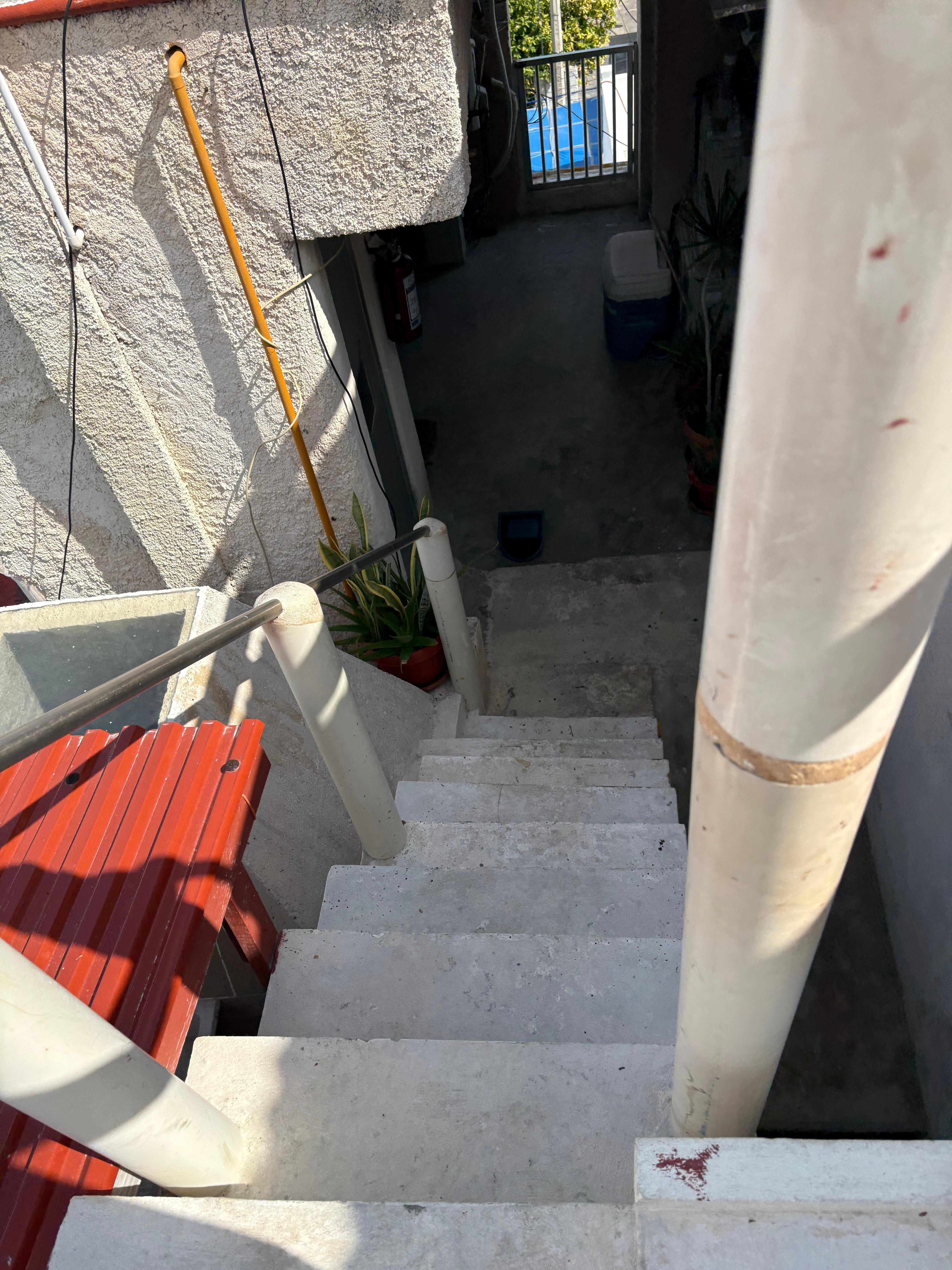 These stairs are coming down from the roof. Really bad