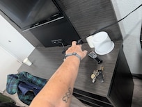 How far the microwave cord reached from sitting on top of the refrigerator