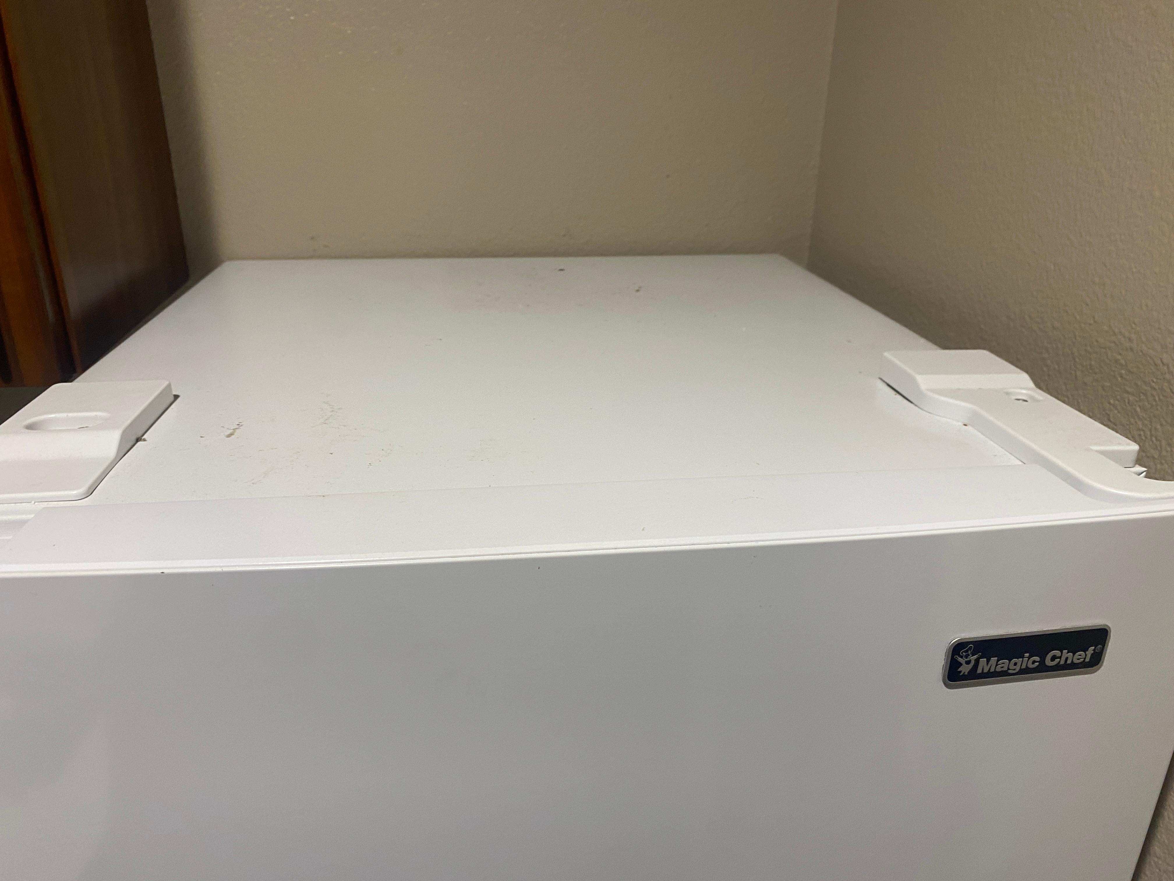 Dirty top of fridge.  Fridge was not a tall one.