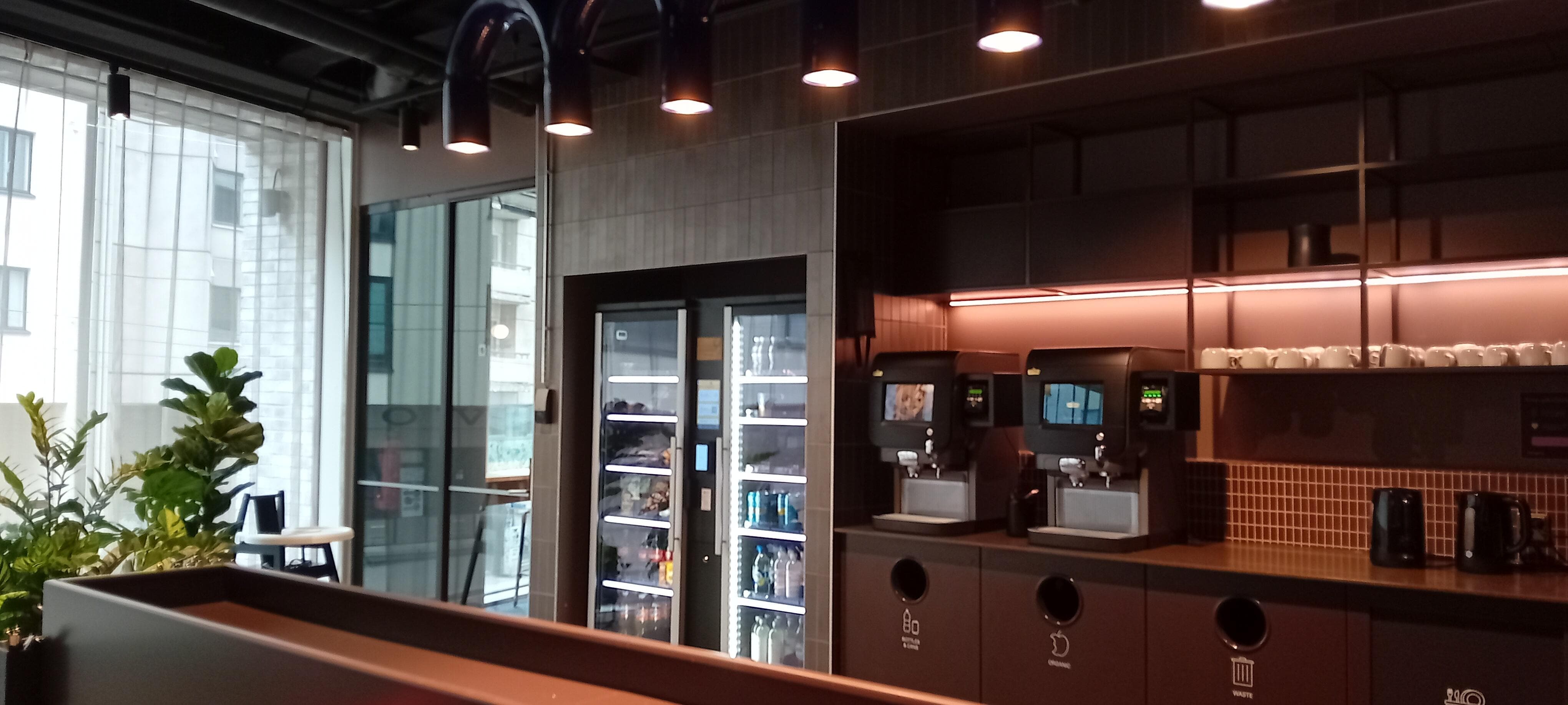 Kitchen area. Includes coffee machines and vending units (buying required), but also kettles, toaster, and fridges for guest to use. 