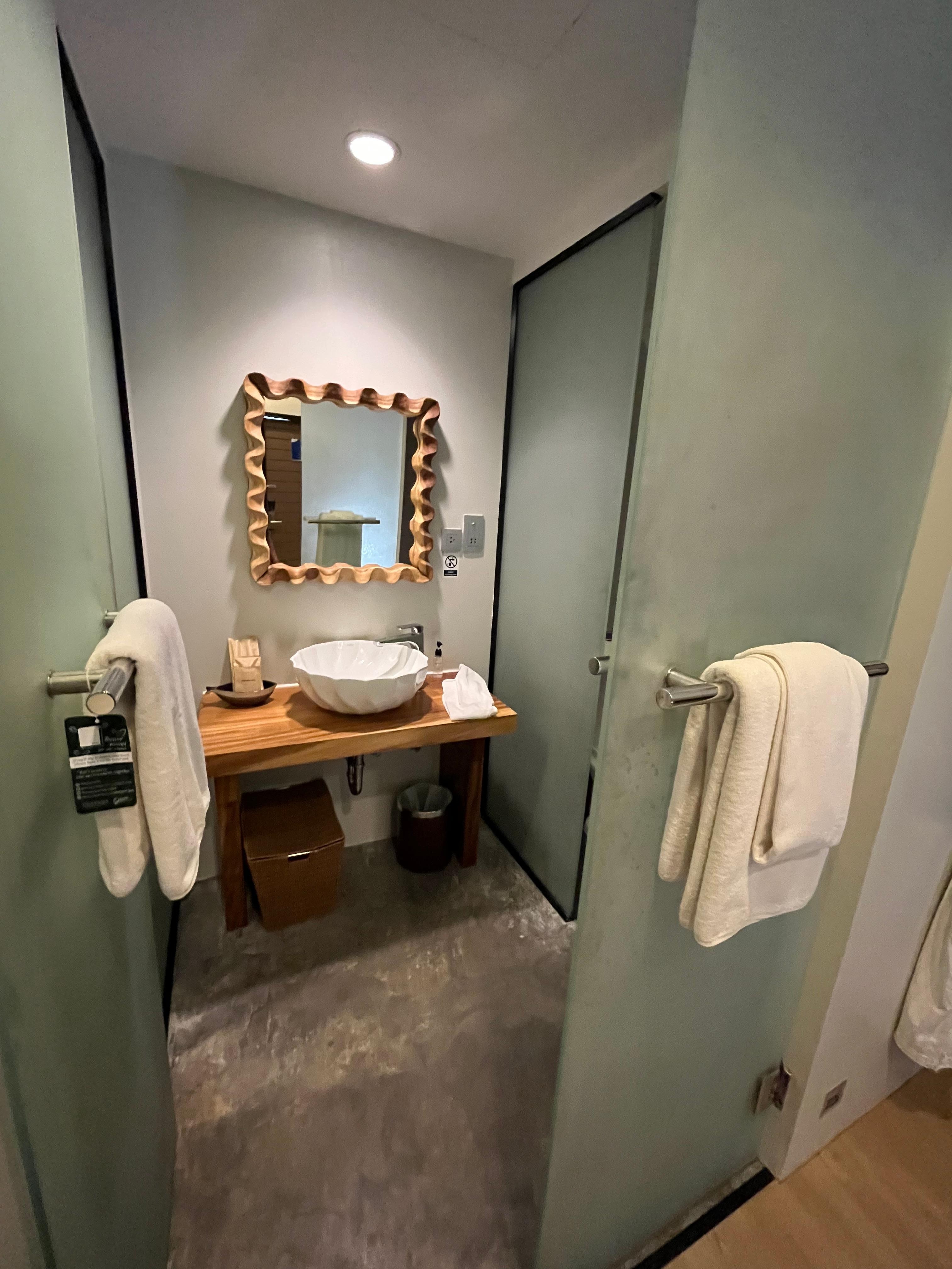 Bathroom with separate toilet and shower areas