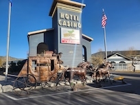 Stage coach and hotel sign