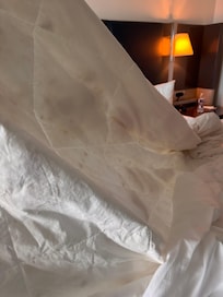 Blanket stained covered with two sheets