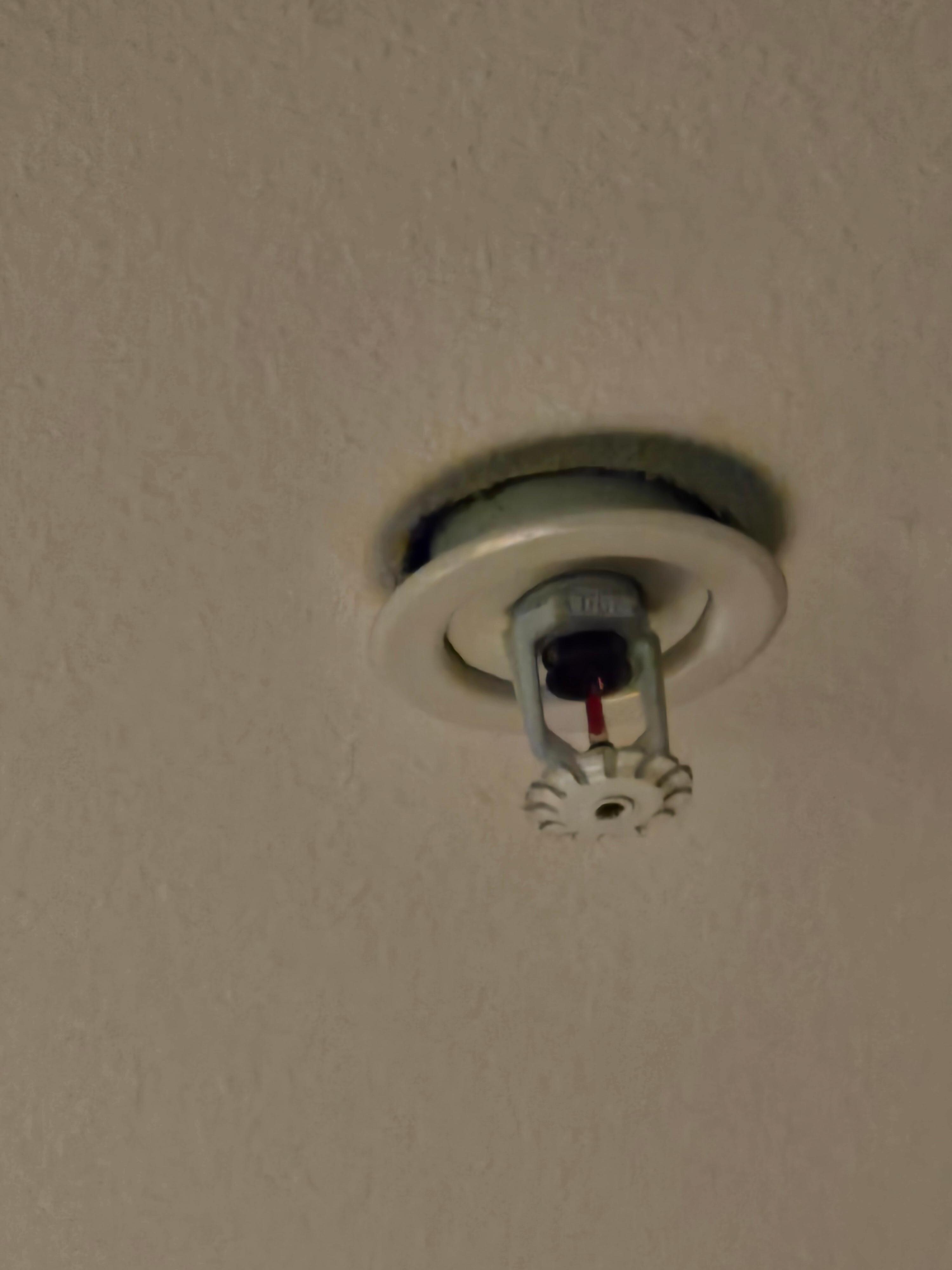 Sprinkler falling down from ceiling