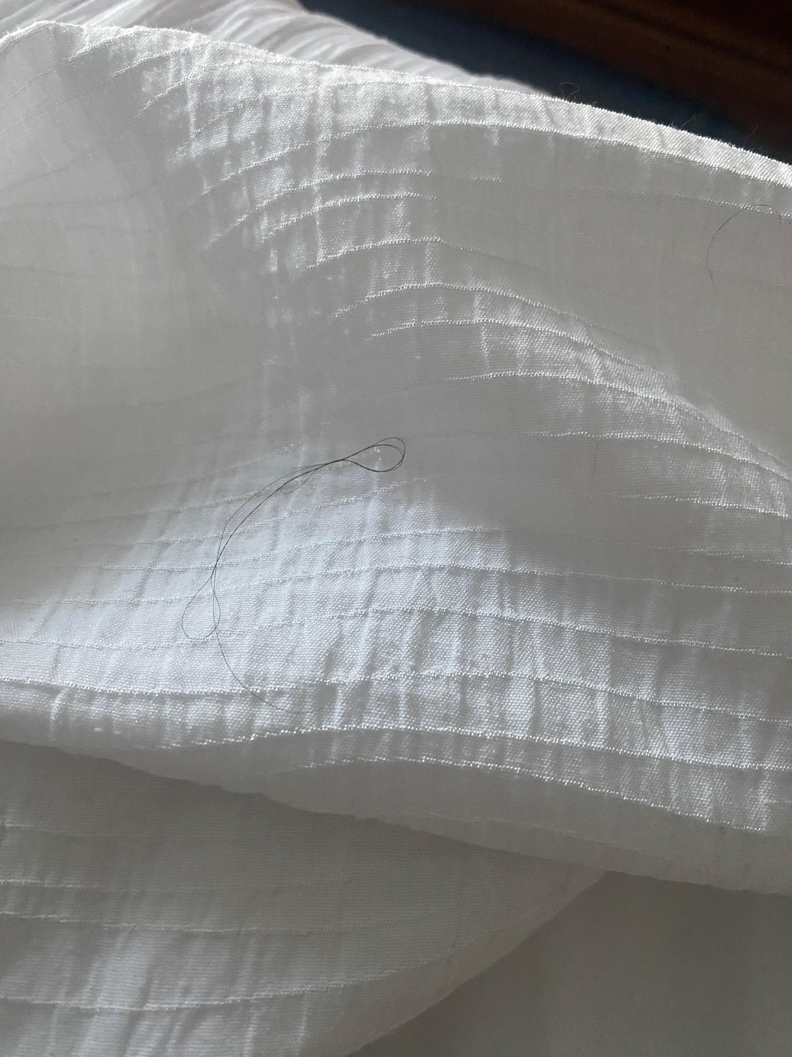 Hair in the bed under the covers and as I pull the cover back more hair so I just removed all that cover 