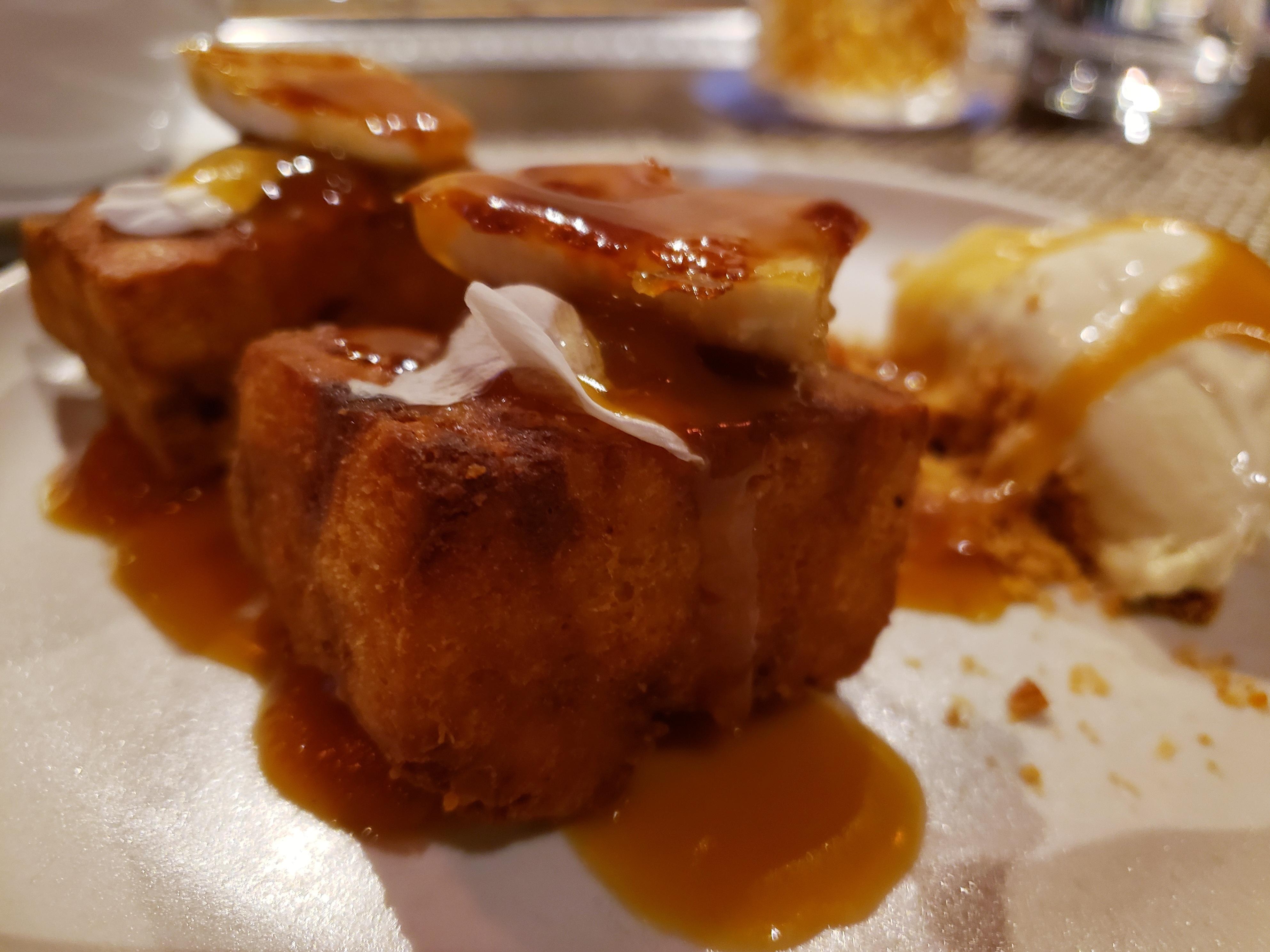 Bread pudding with banana and hot caramel