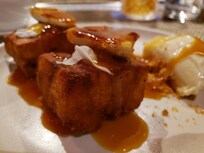 Bread pudding with banana and hot caramel