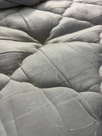 Kingsize bed deep, and long “trough like” hole on right side of bed (Room #207).