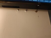 Holes from previously mounted tv