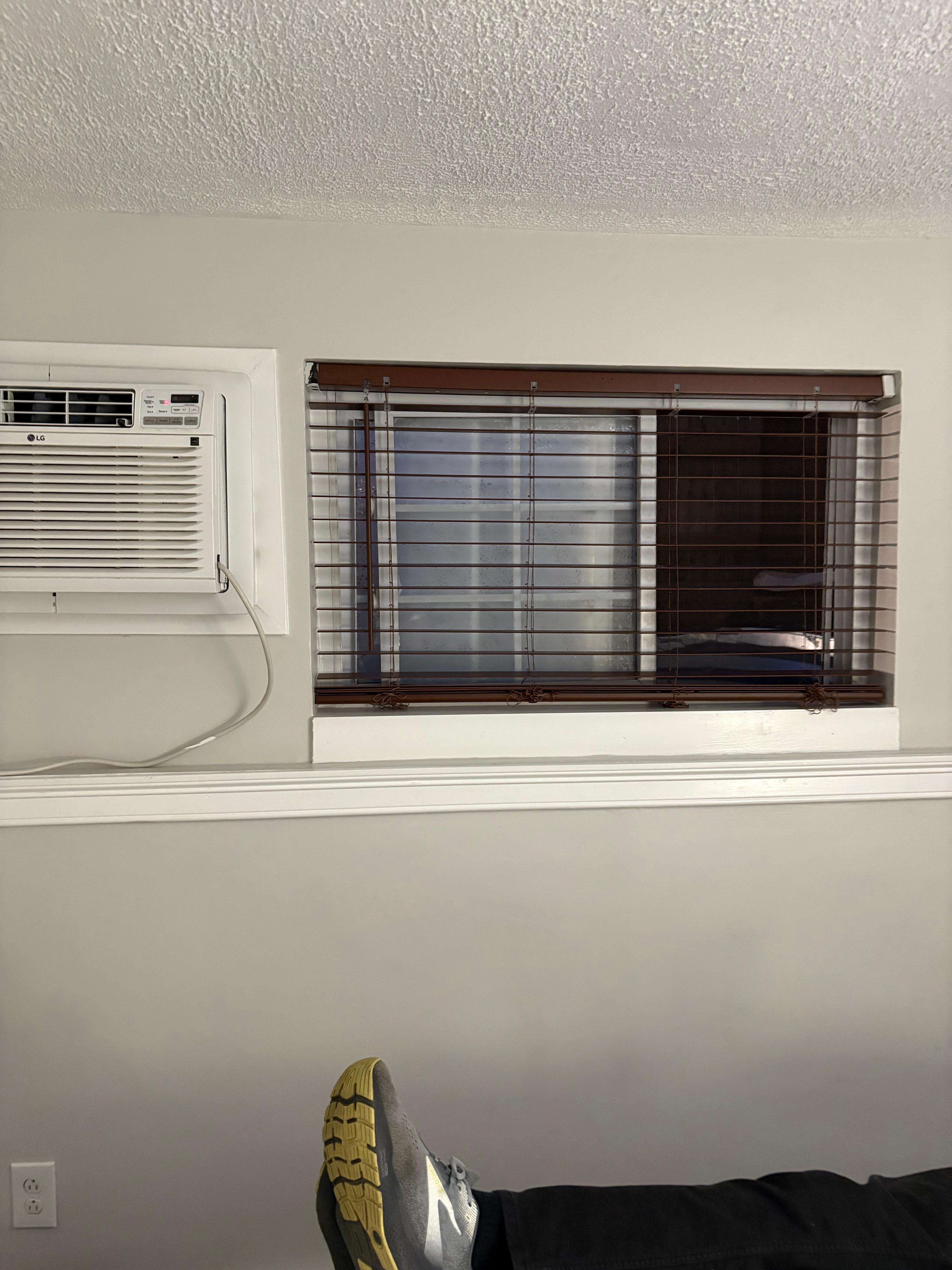 Window in basement facing high traffic road