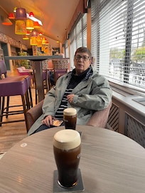 Having a relaxing drink in lovely surroundings.