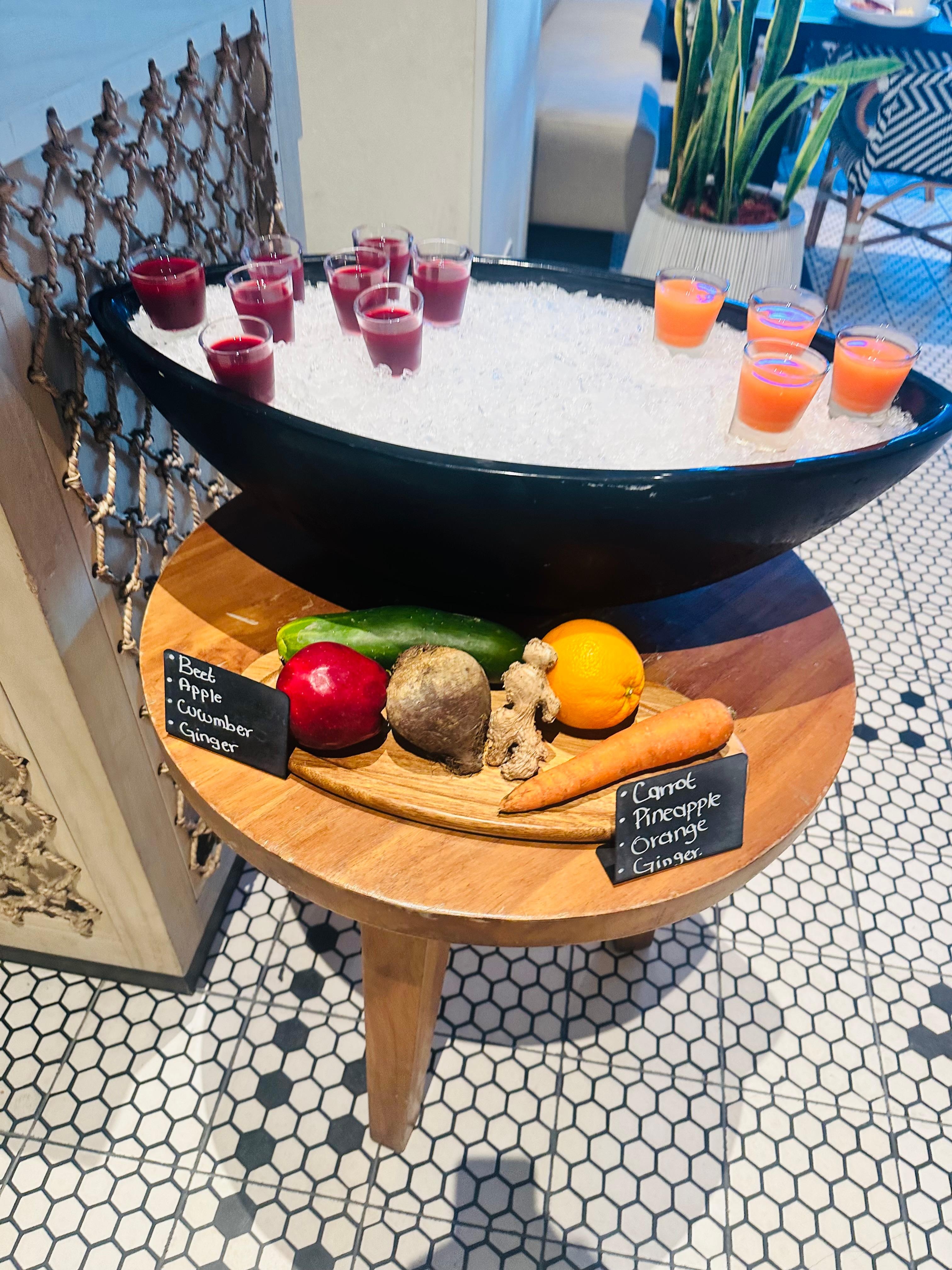 Healthy fresh shots of veggies and fruit at buffet each morning 