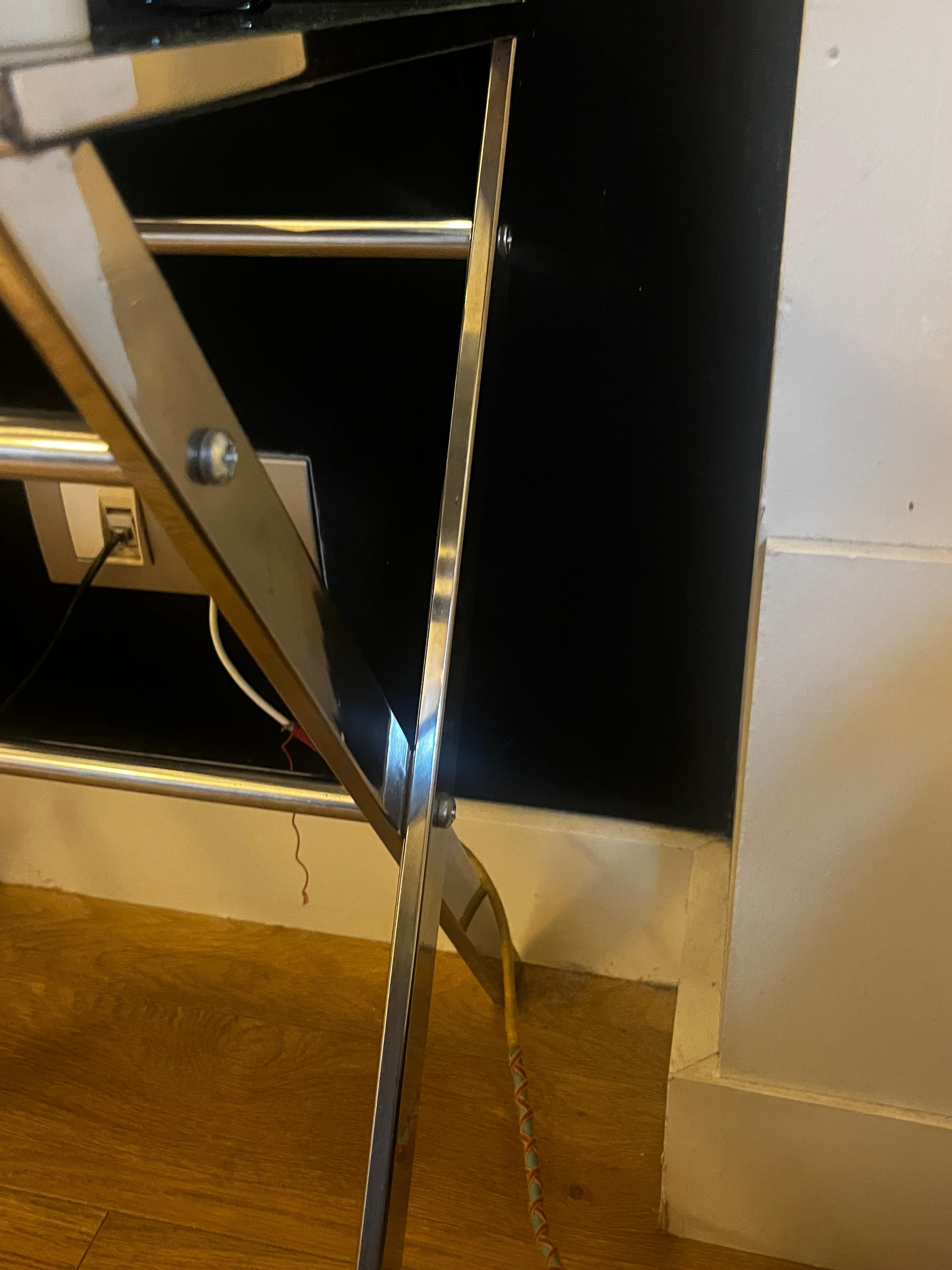 Visible dirt behind the bedside table.