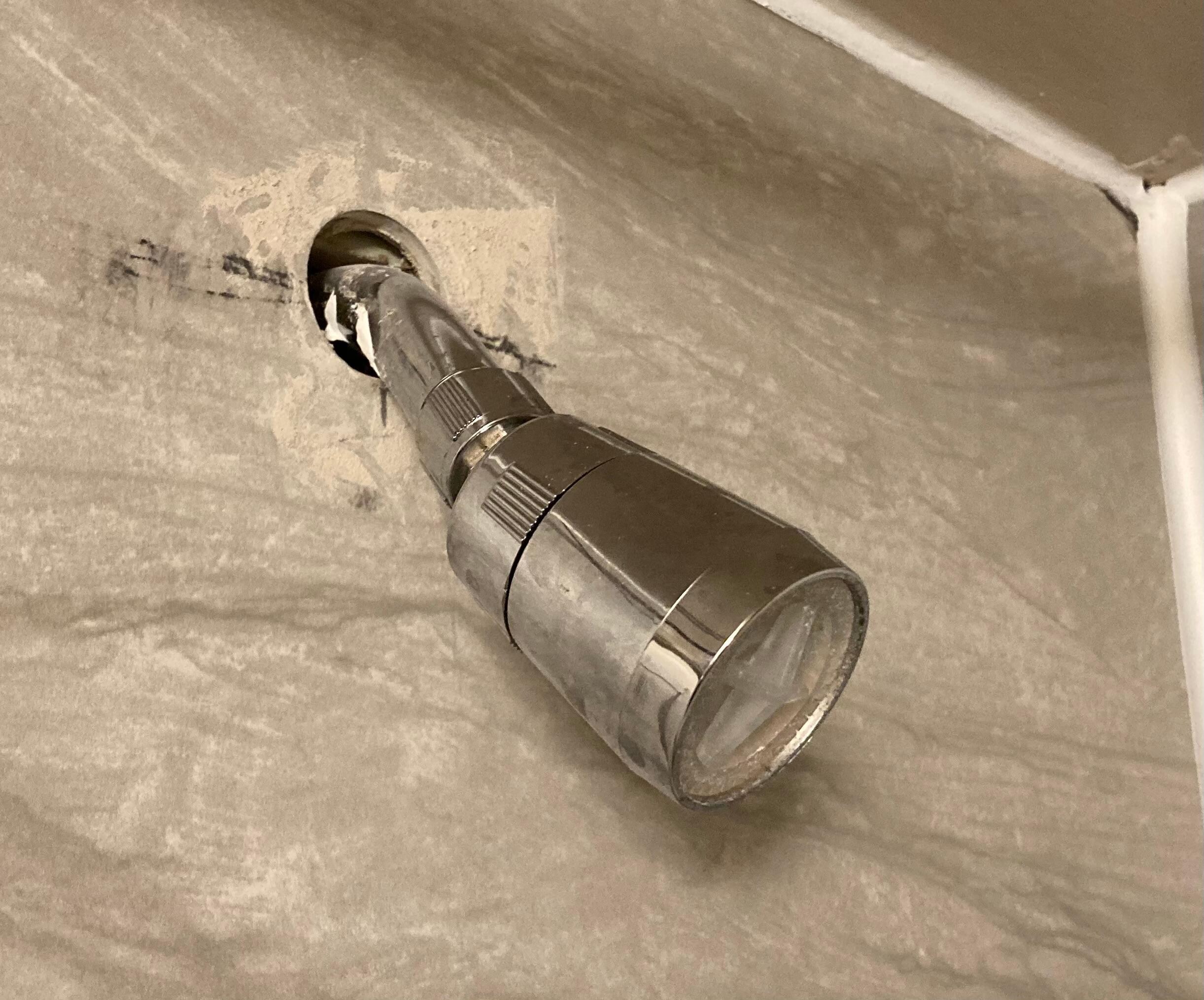 Shower head coming through wall