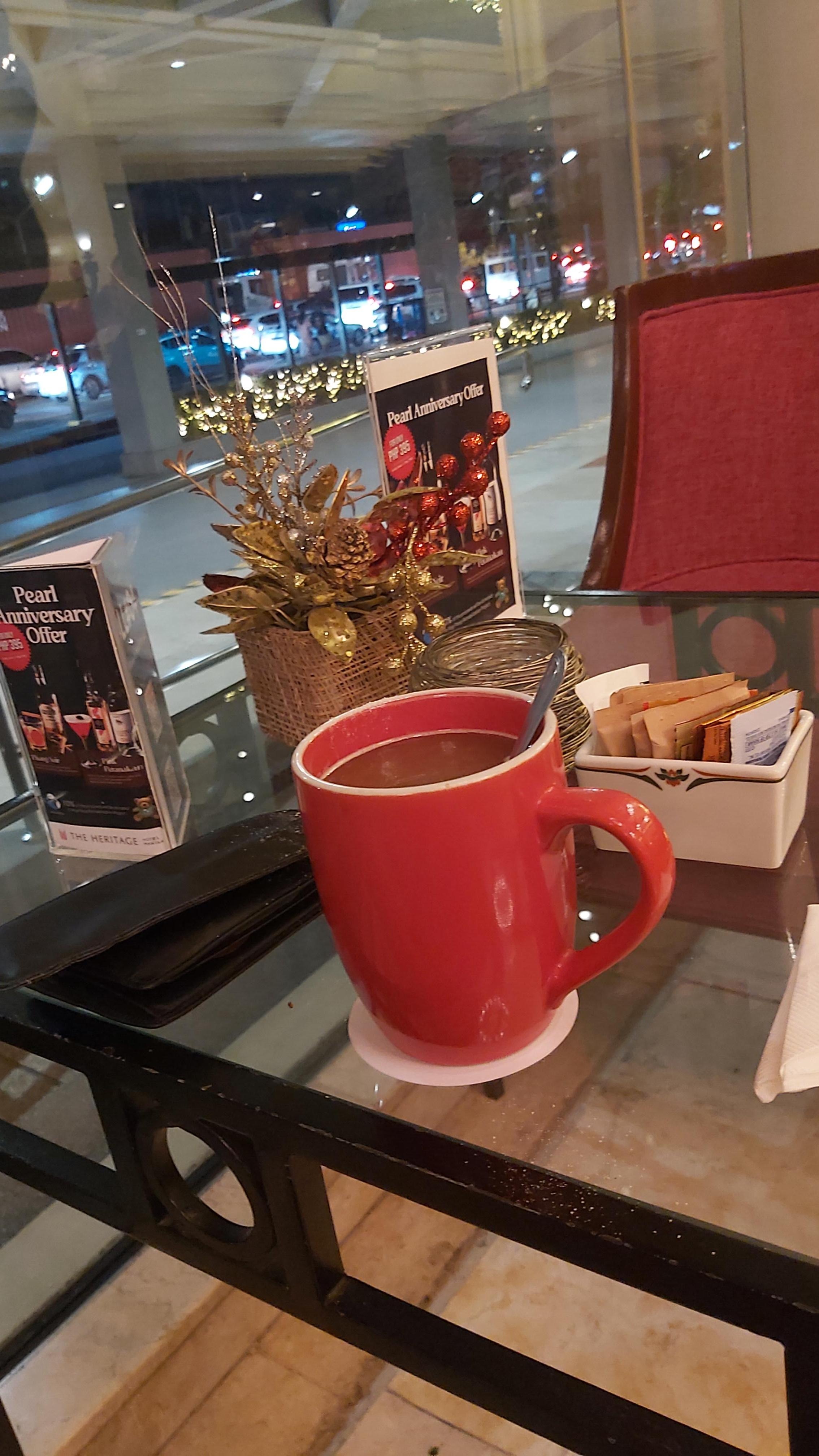 Relaxing with coffee in lobby