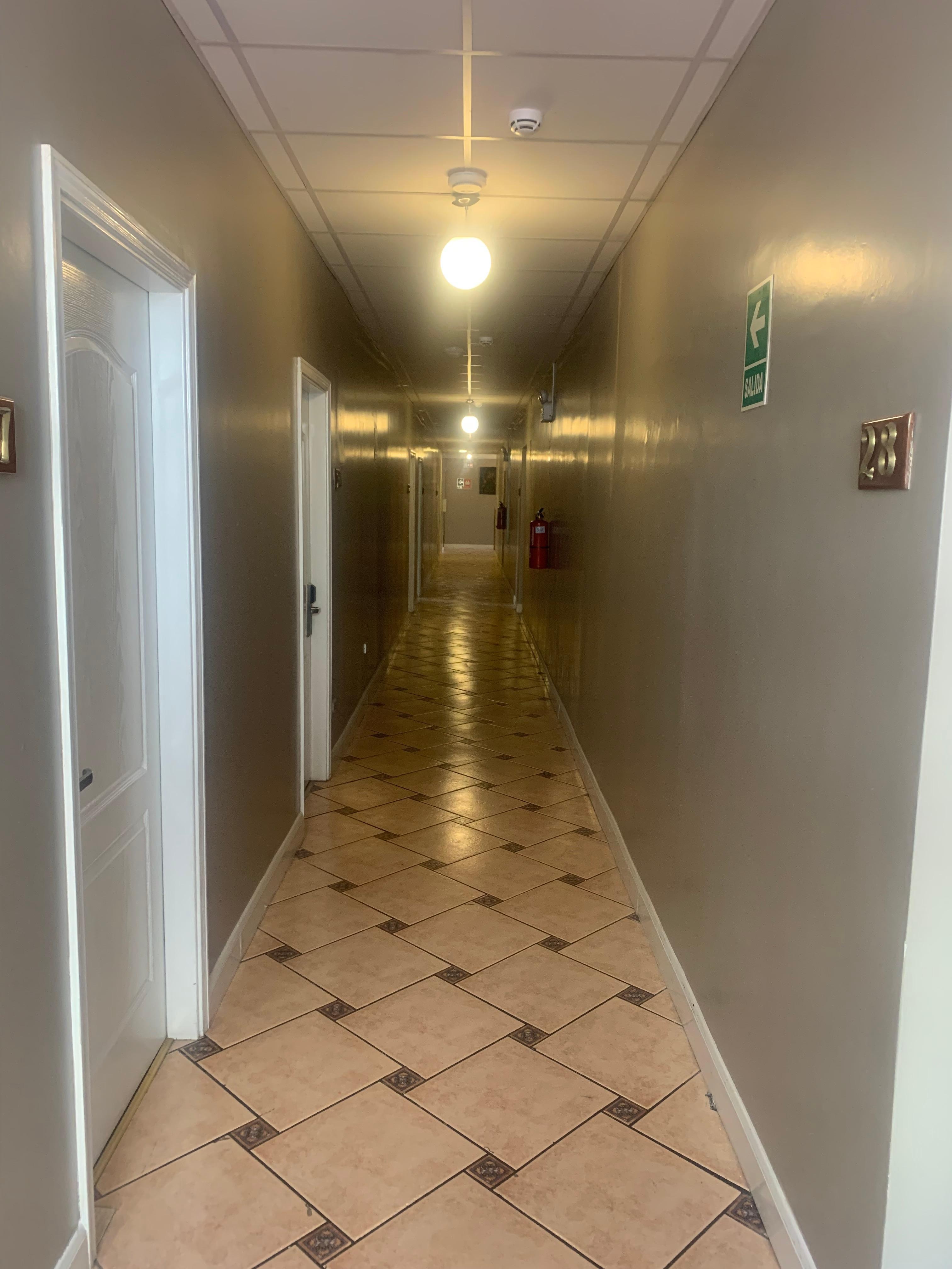 Dismal dark hallways with mismatched light fixtures