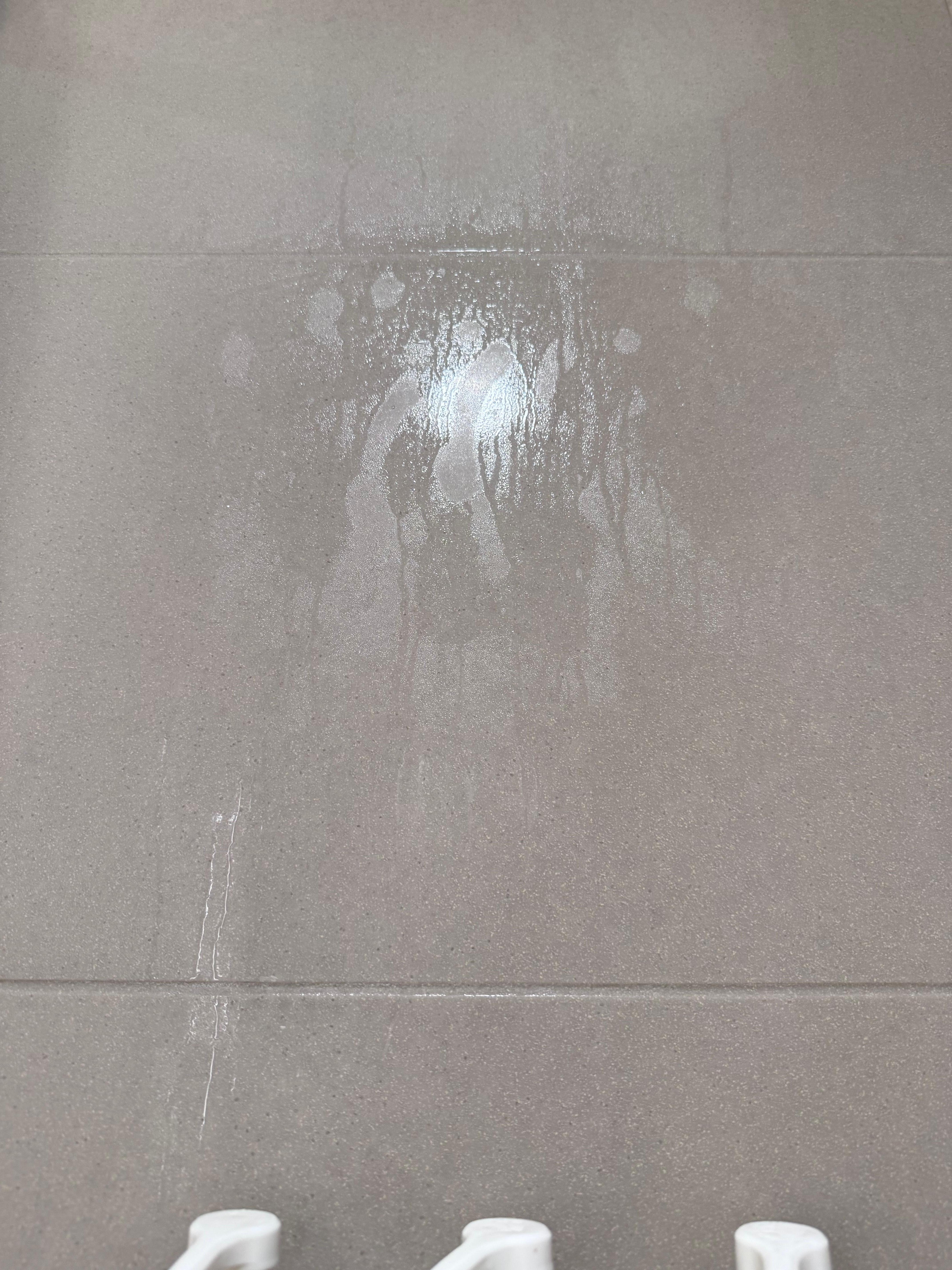 Hand prints all over the shower