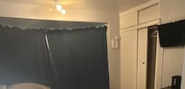 Wardrobe door holes and ill fitting curtains
