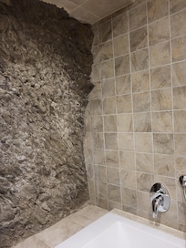 Bathroom Hoffmeister Depandance with a natural stone wall