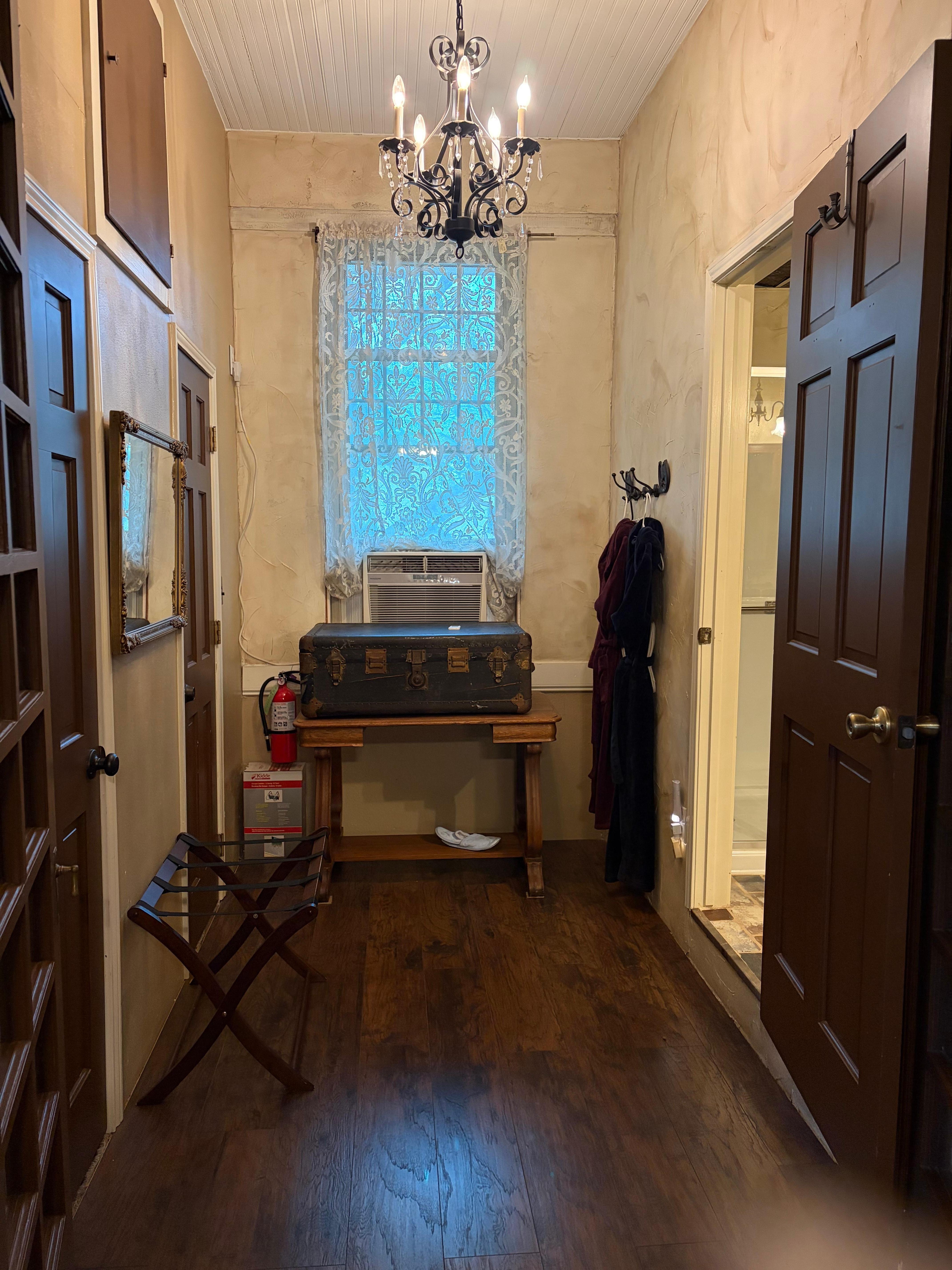 The hallway to the bathroom! Notice Medium and Large Robs provided. 