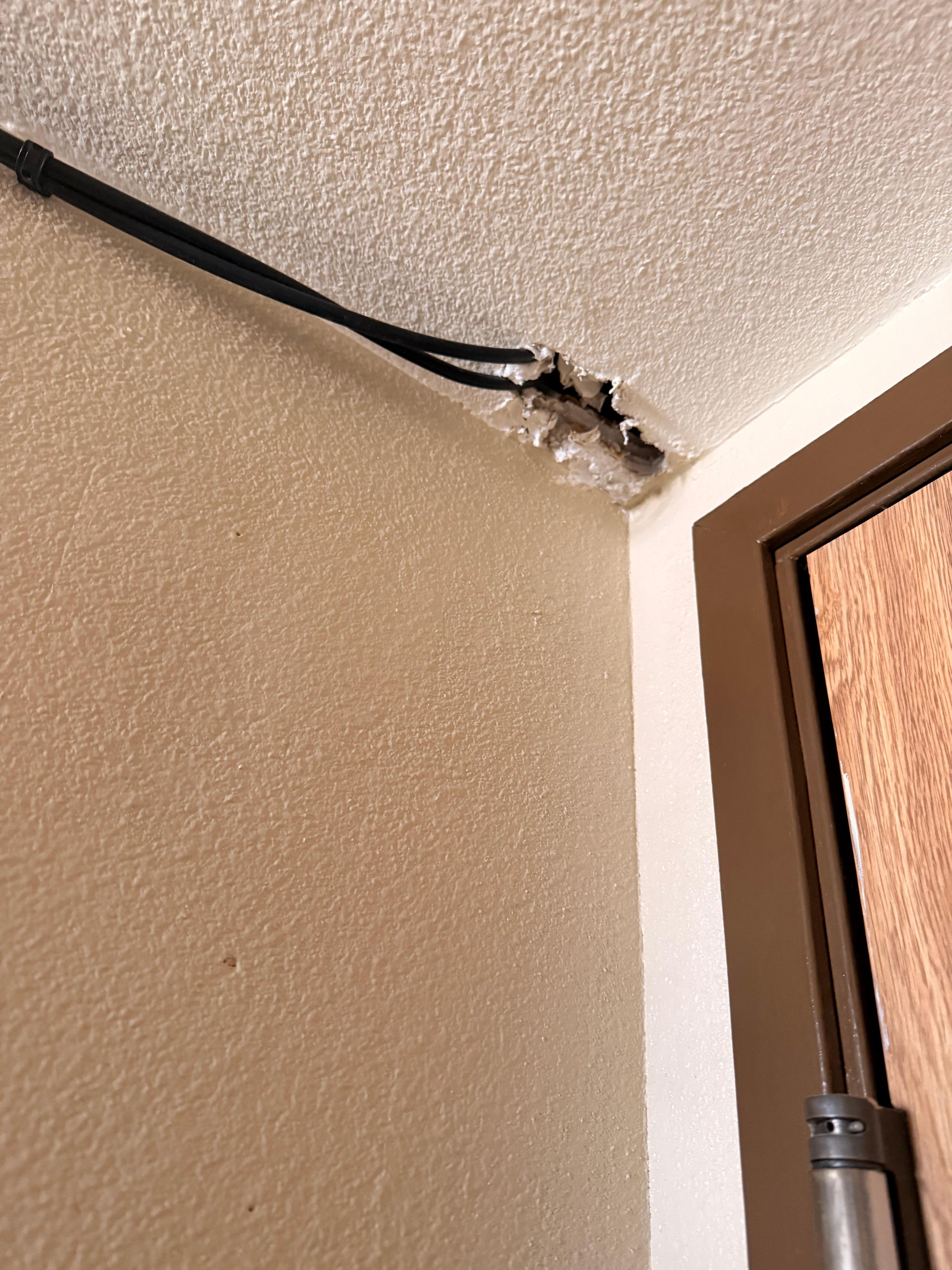 Hole in ceiling. Not fire safe. Not properly covered and secured. 