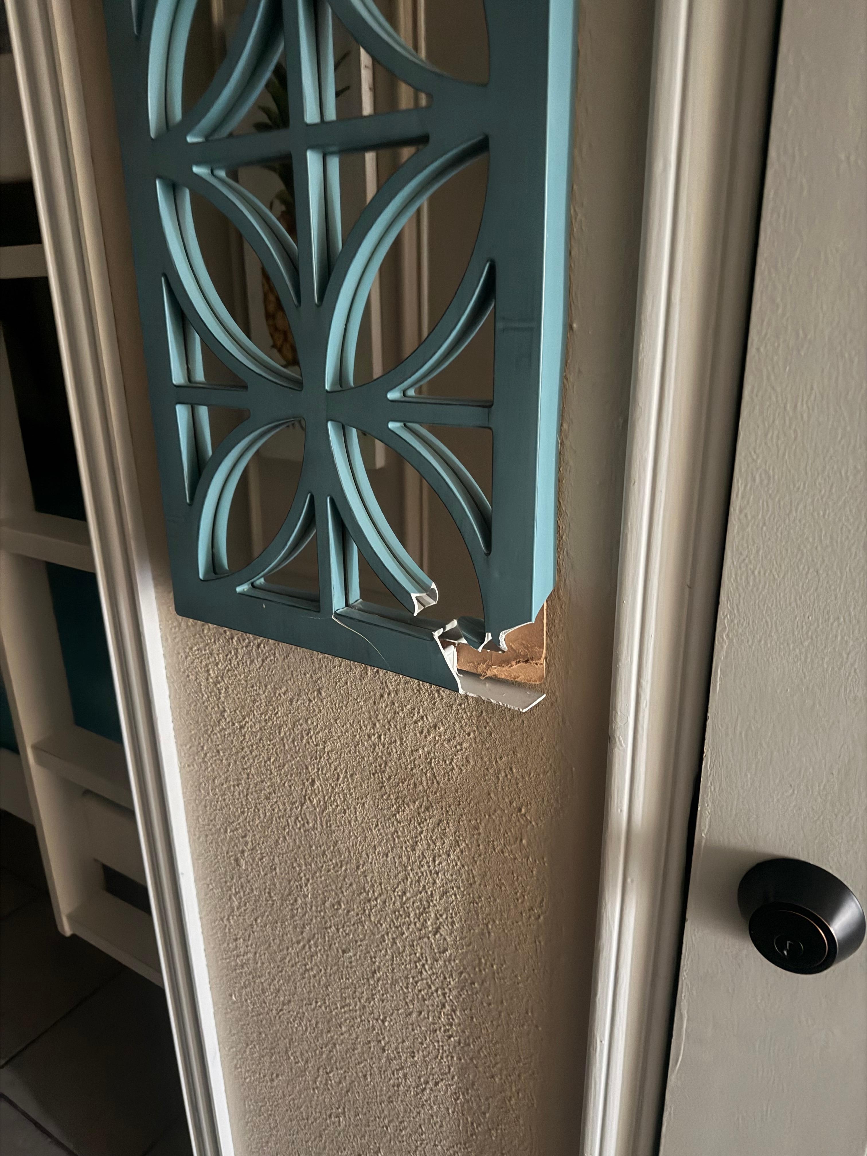 The broken picture on the wall