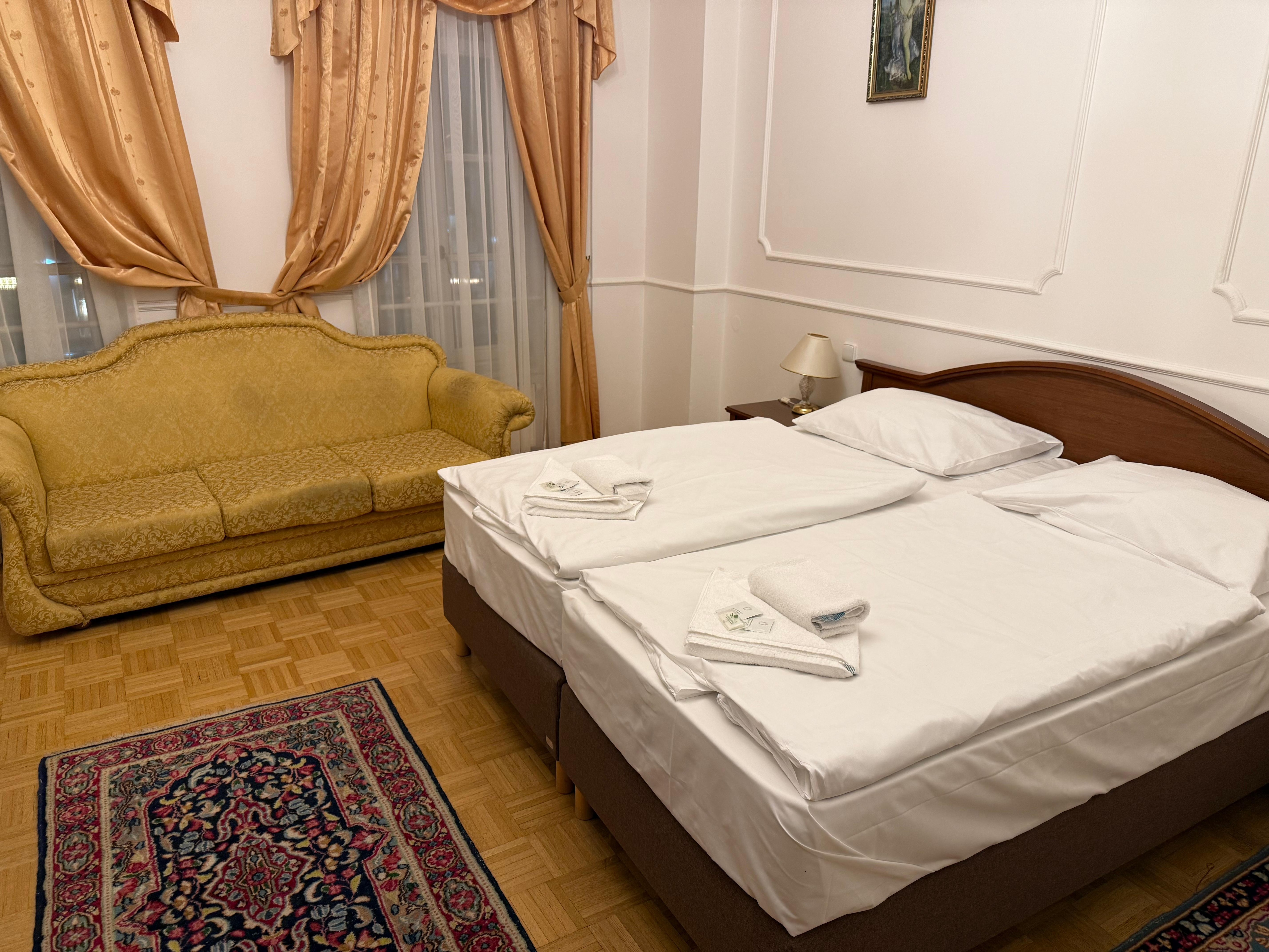 Bed and sofa are aged