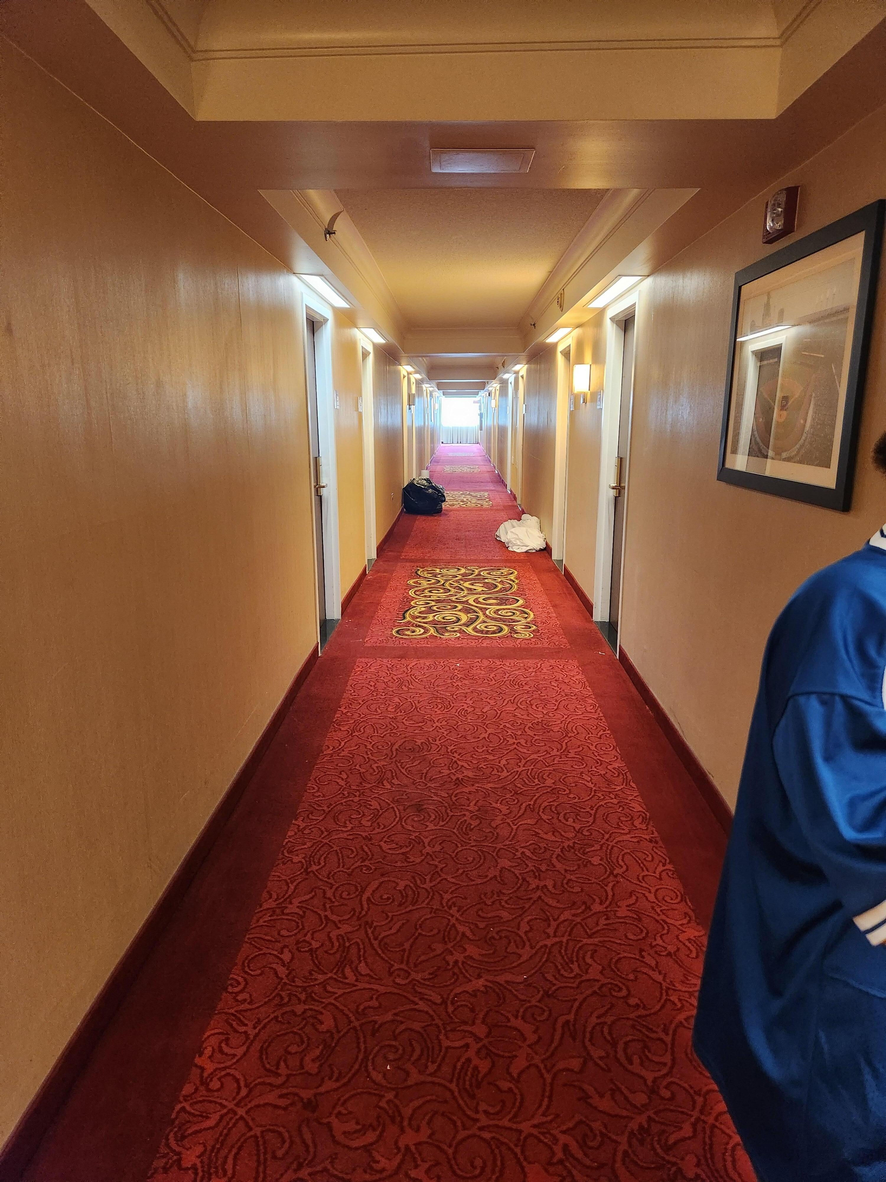 Garbage bag and dirty sheet on floor we had to walk past on way to room