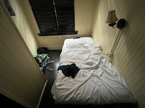 The inside of my cabin. The bed was actually pretty comfortable. But the only linens I got were sheets. So maybe might want to see about a blanket.