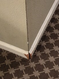 Baseboard and wall
