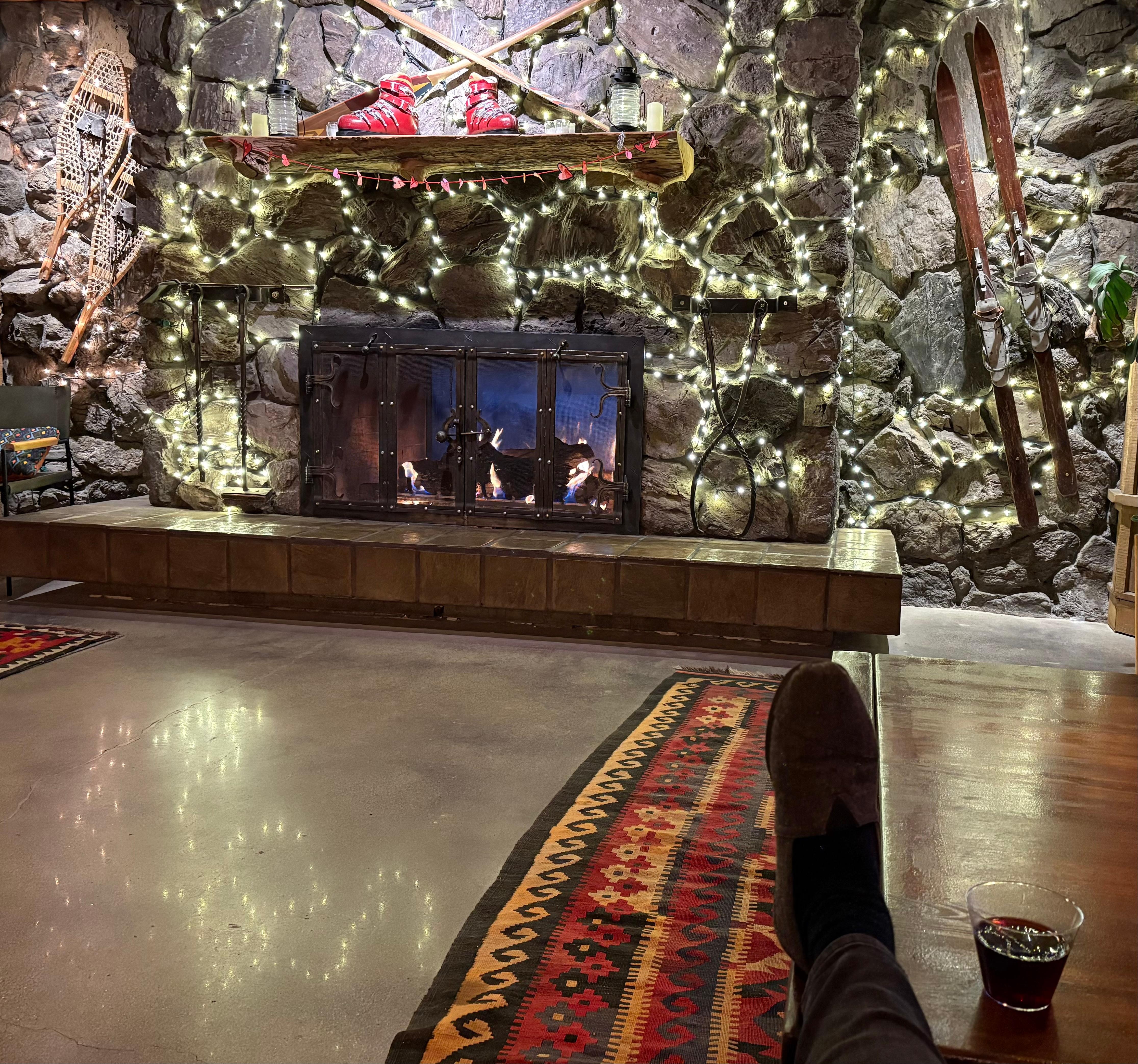 Reading by the fire with welcome glass of wine