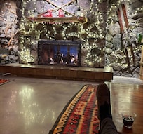 Reading by the fire with welcome glass of wine