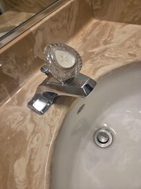 Bathroom faucet near shower