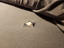 a tear the sheet on the bed