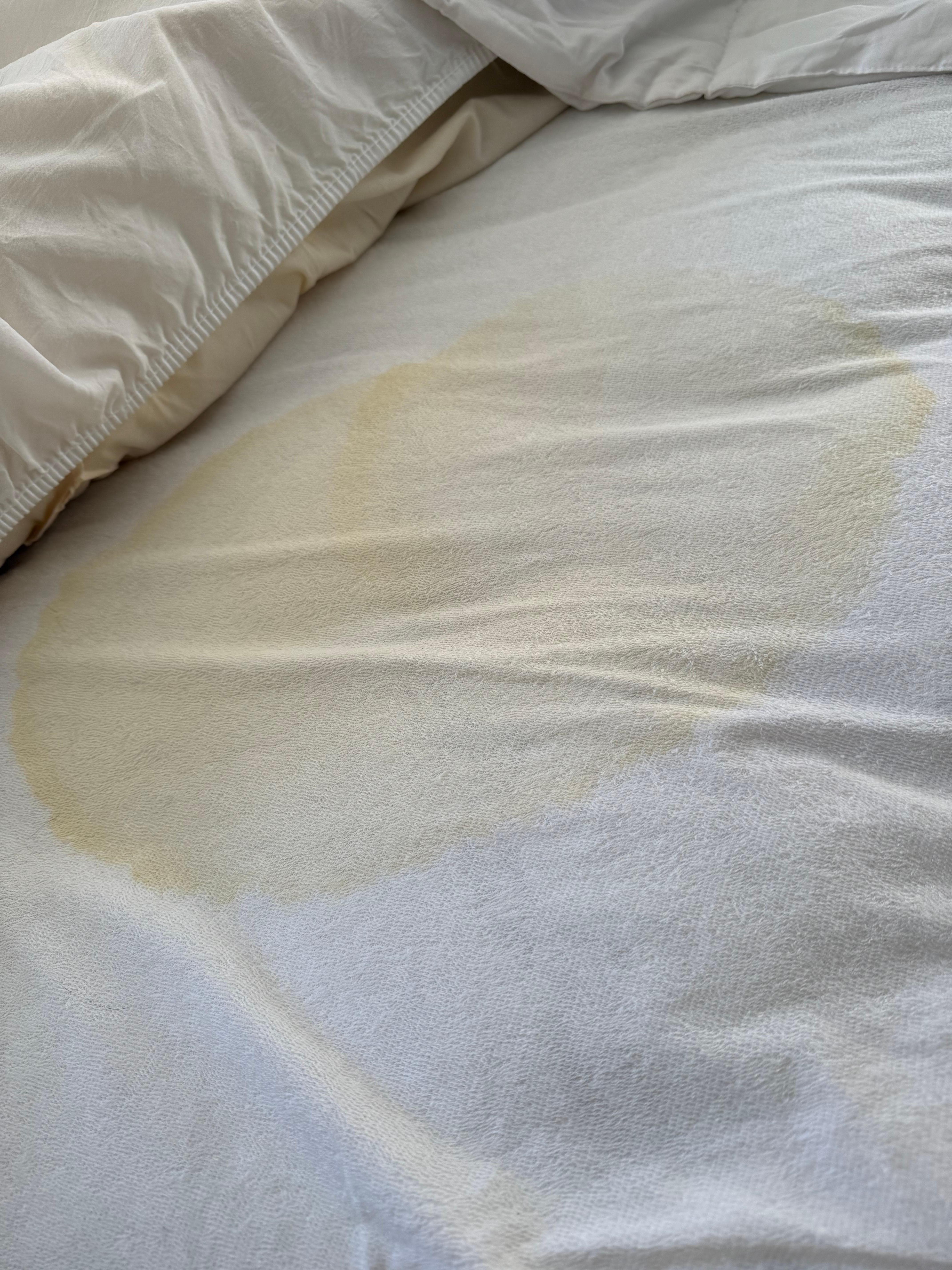 The mattress pad had huge fluid stains they covered with fitted sheets